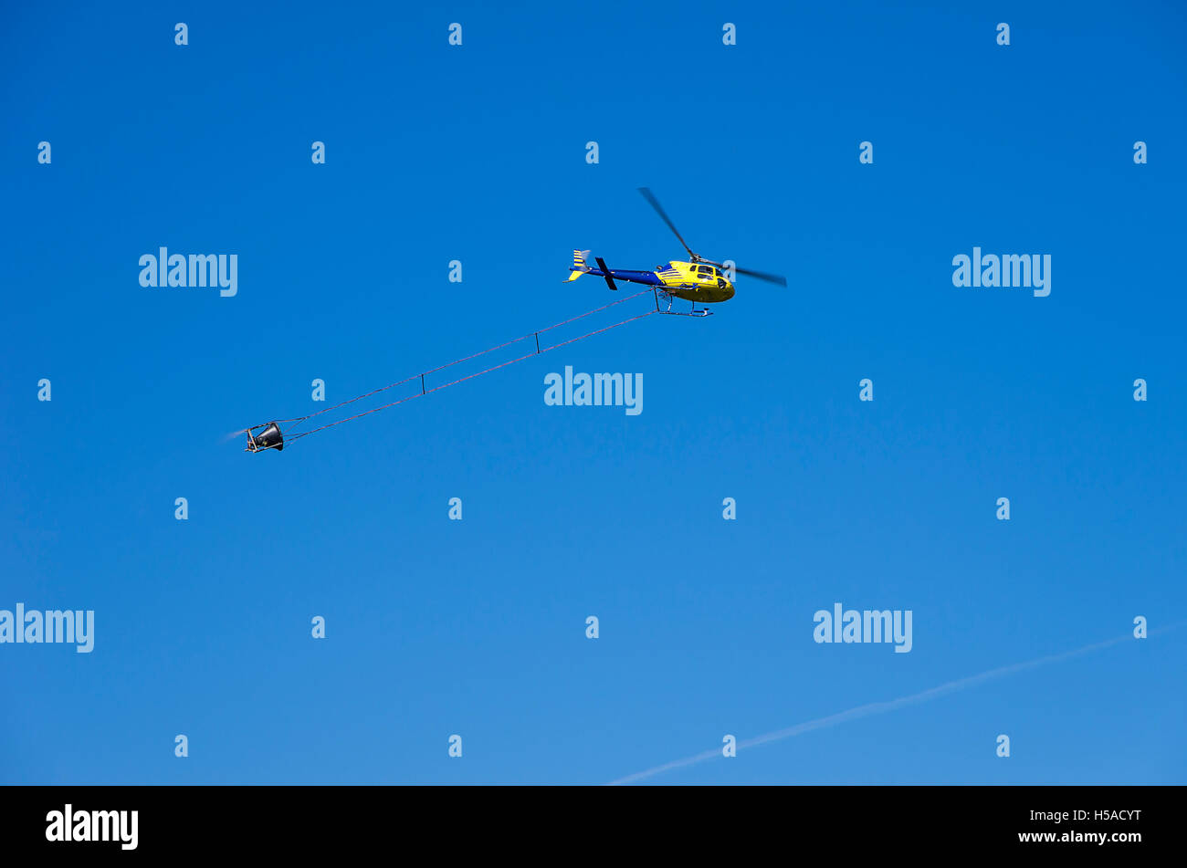A helicopter sprays chemical substances Stock Photo - Alamy