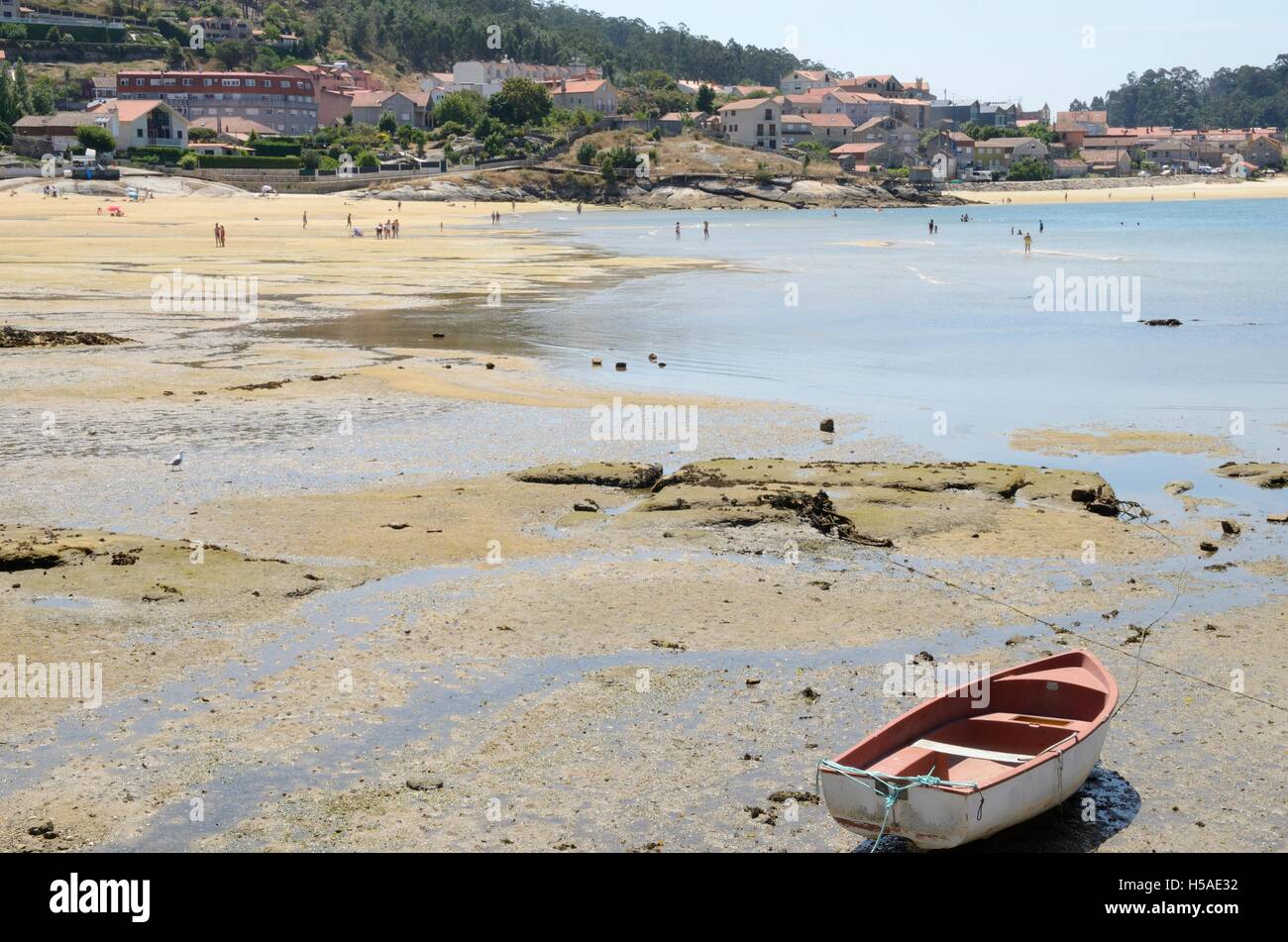 People having a bath in the beach of the village of Aldan, Galicia ...