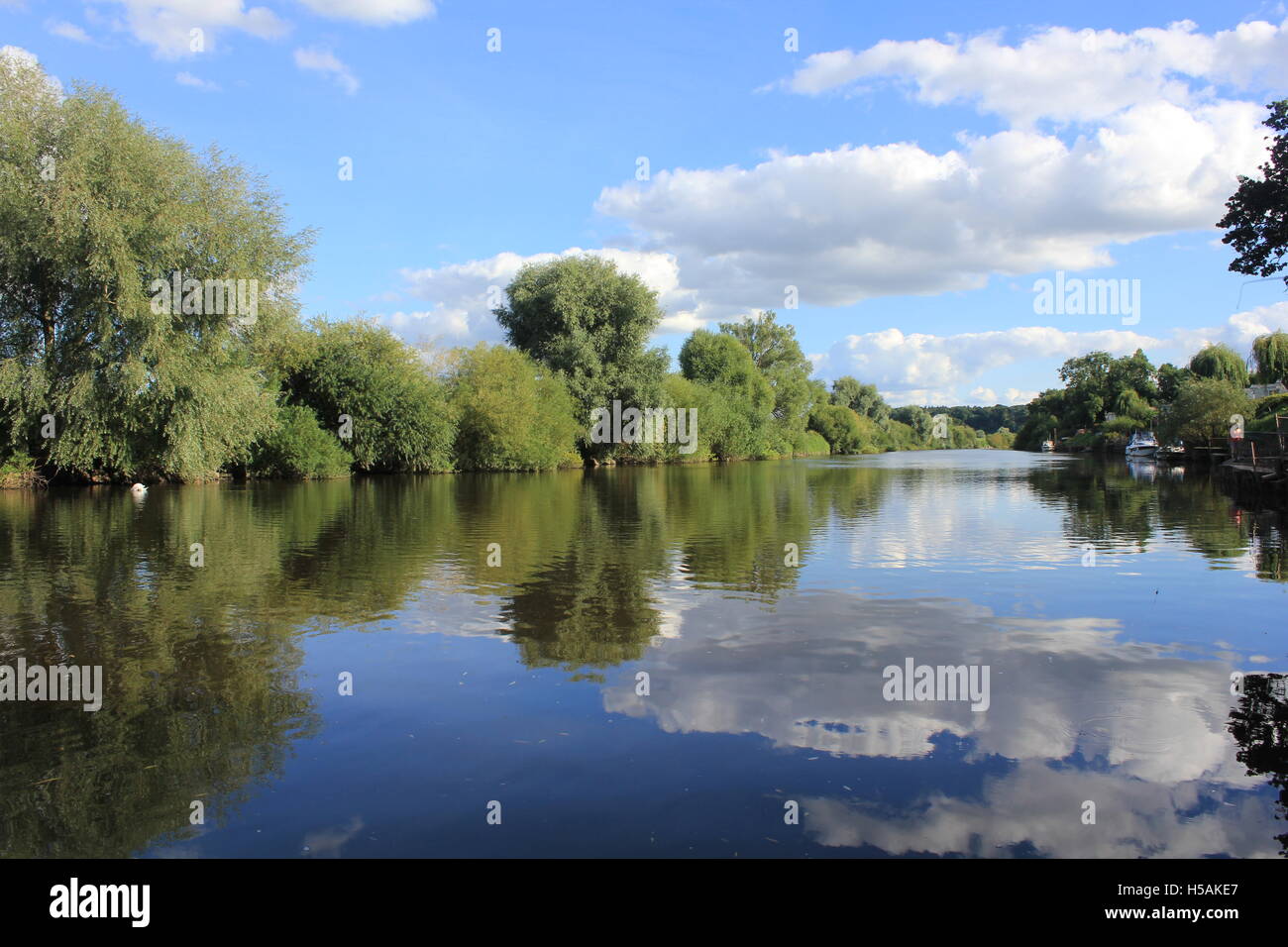 looking down river at the reflections in the water Stock Photo - Alamy