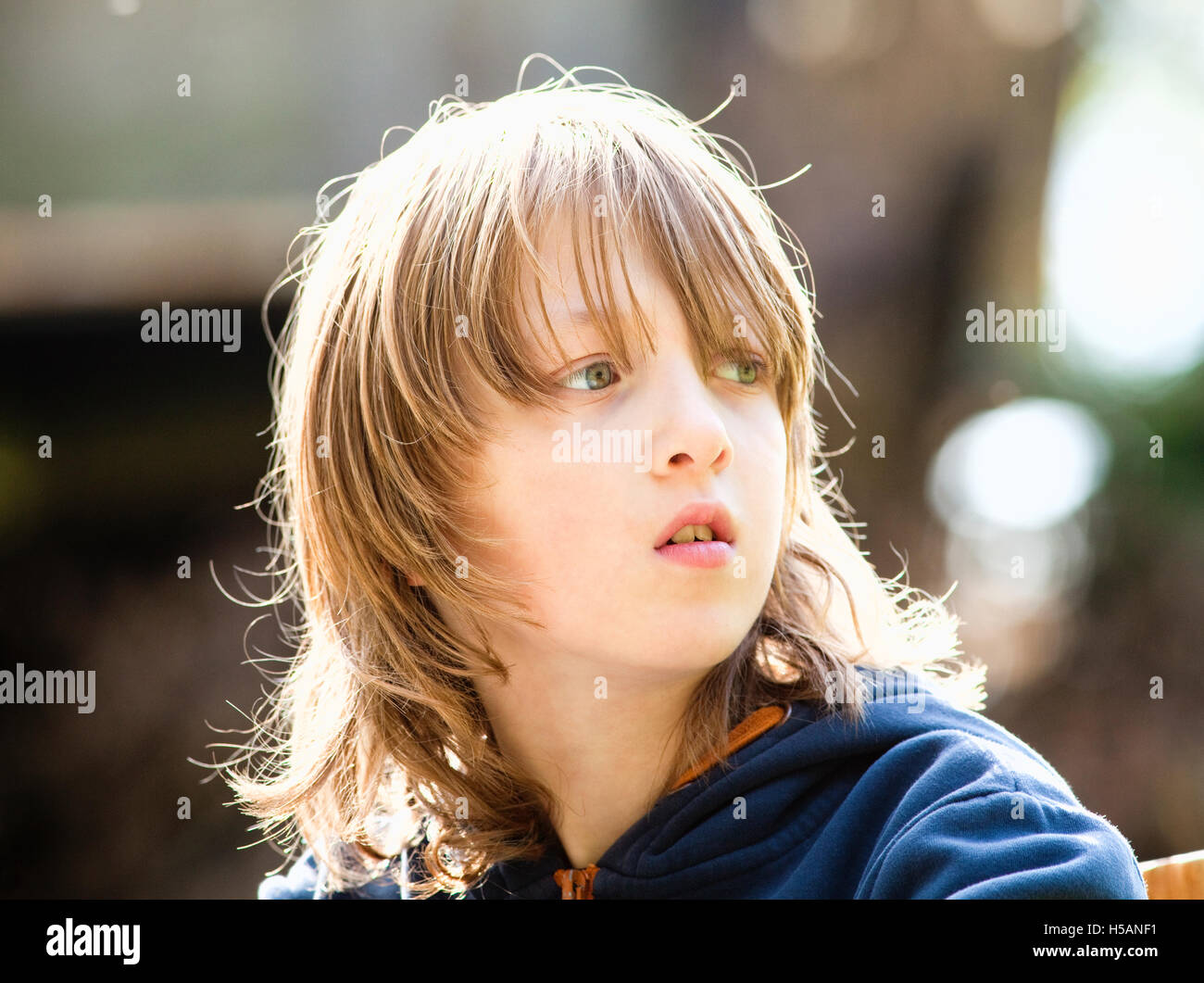 Boy with long hair hi-res stock photography and images - Alamy