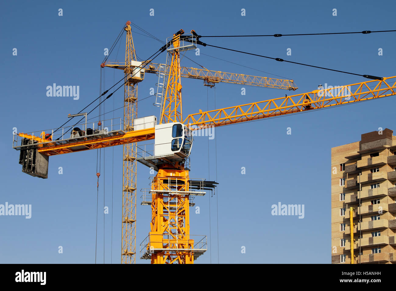 Yellow crane tower building hi-res stock photography and images - Alamy
