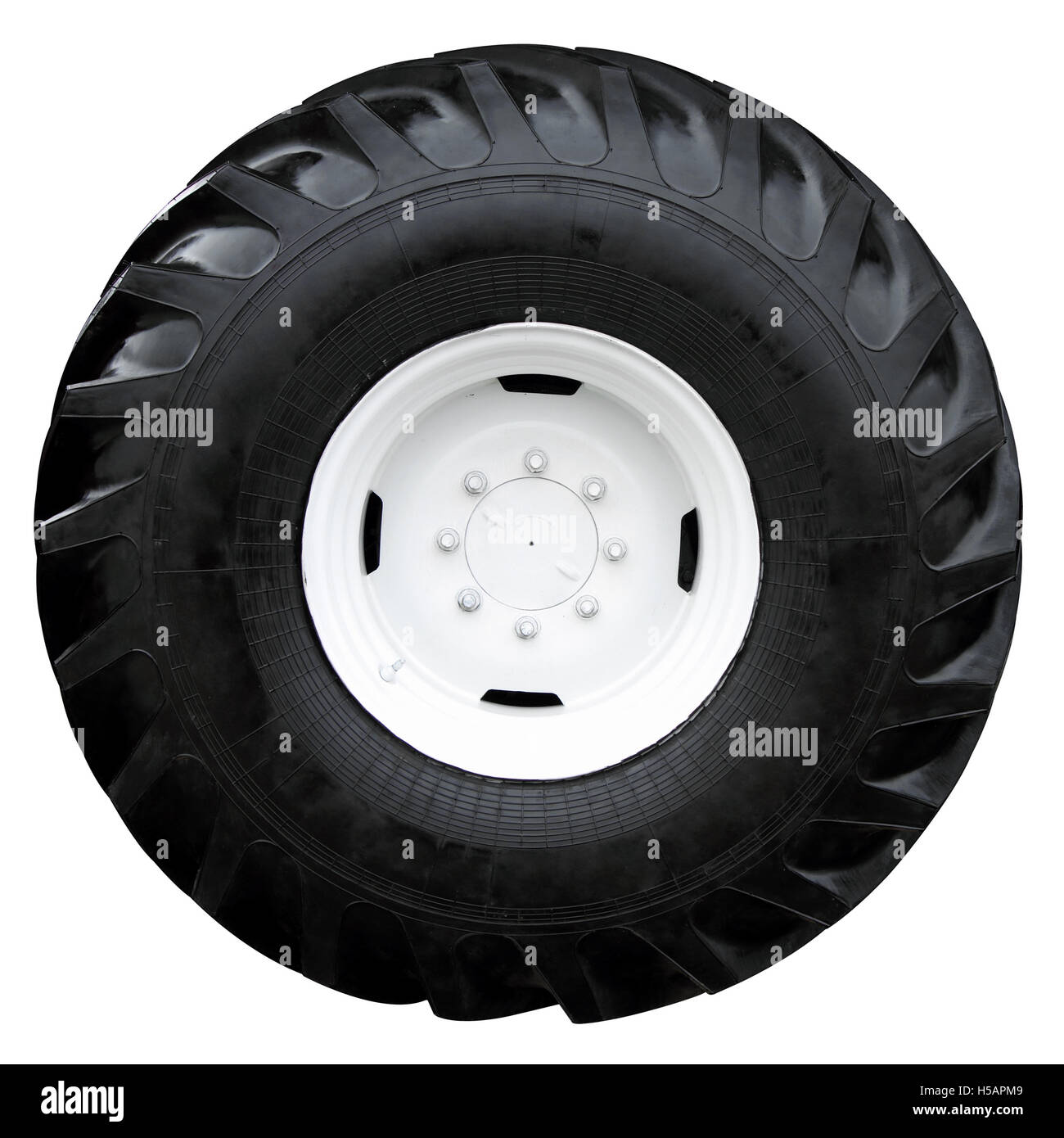 Modern tractor wheel isolated on a white background Stock Photo - Alamy