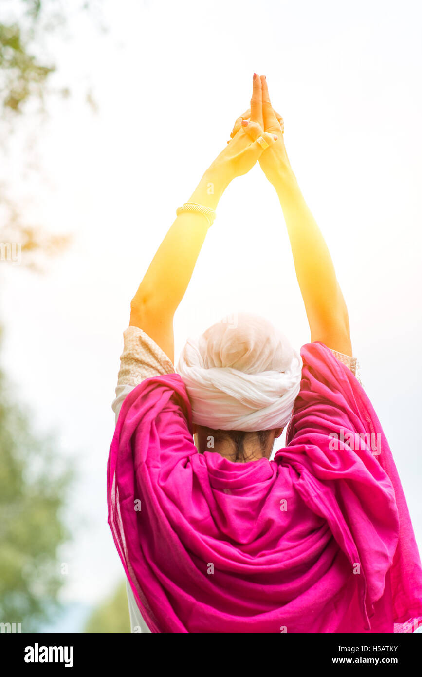 Yoga position arms raised to the Sun Stock Photo - Alamy