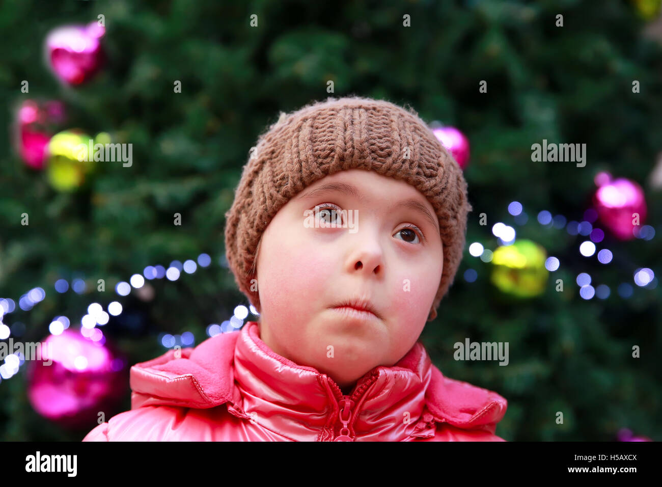 Young girl on background of the Christmas tree Stock Photo - Alamy