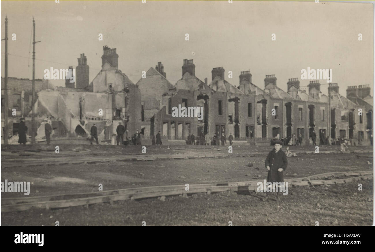 This image shows a street that has suffered damage from a fire ...