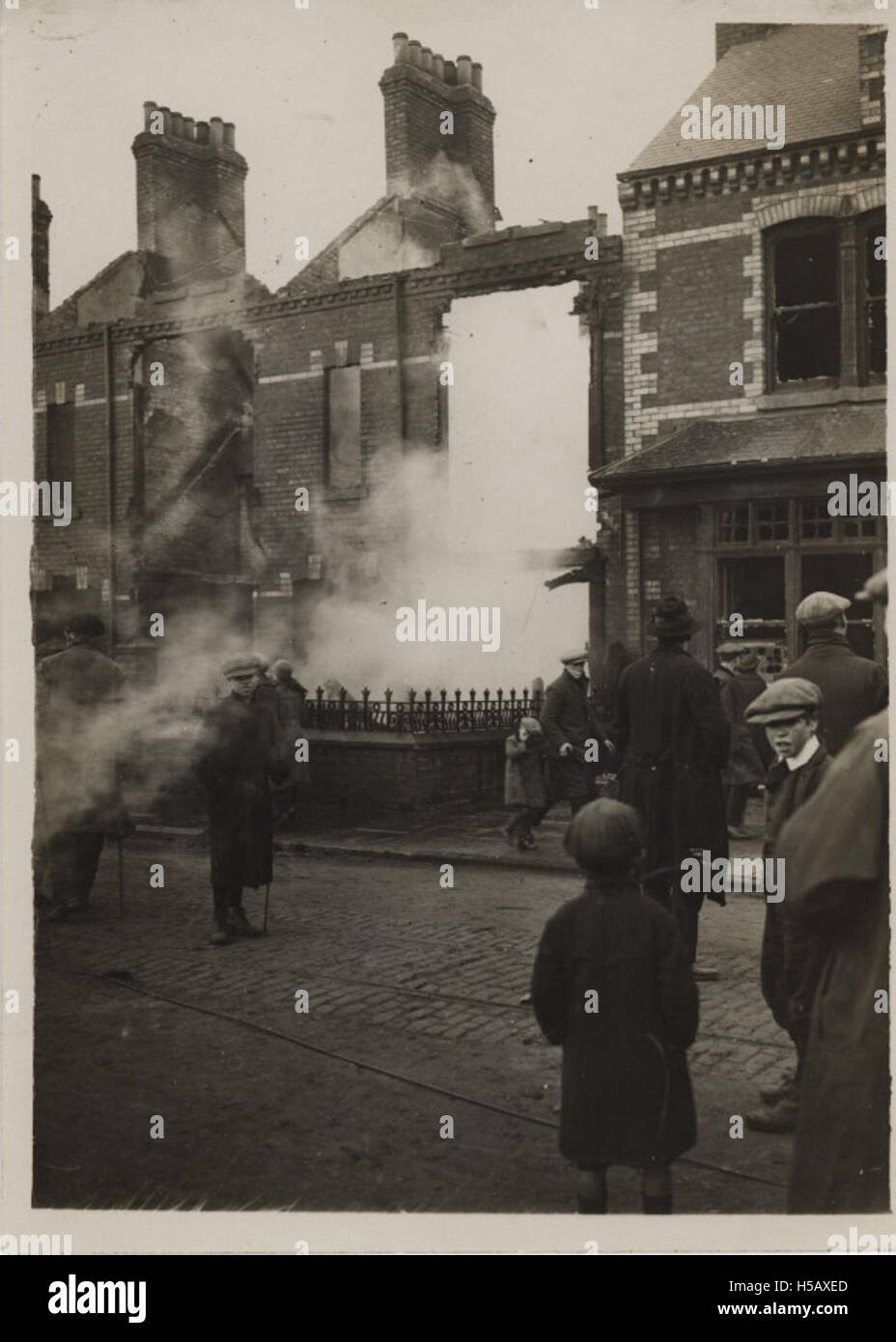 An image of a smouldering building, showing the aftermath of a fire ...