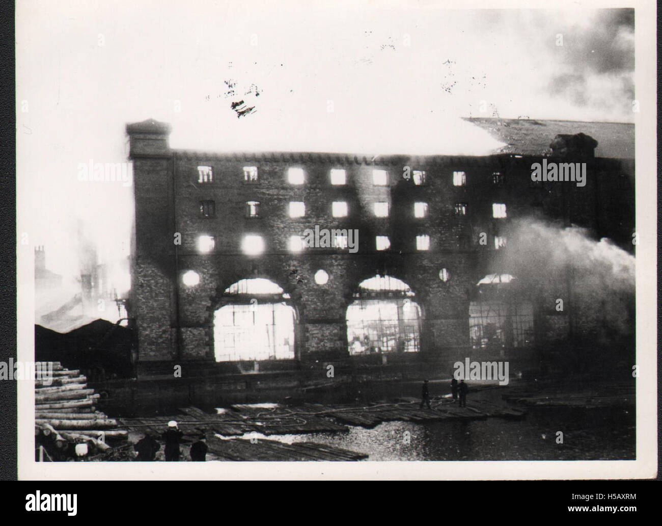 A photograph depicting the aftermath of a match factory fire in 1954 ...