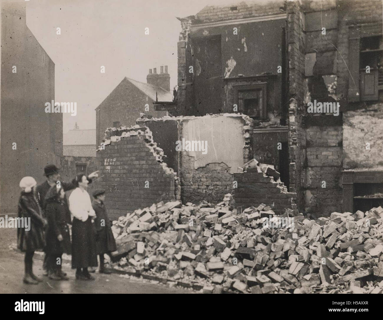 The phrase Looking at Rubble suggests a scene of devastation or ...