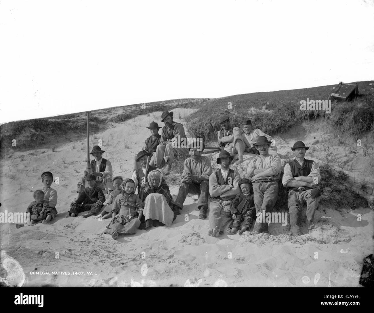 This image captures an individual in a relaxed, laid-back posture ...