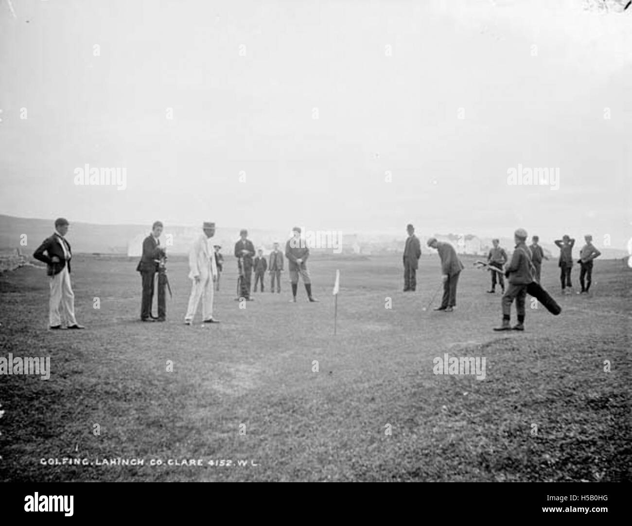 This image depicts a golfing scene at Lahinch Golf Club in County Clare ...