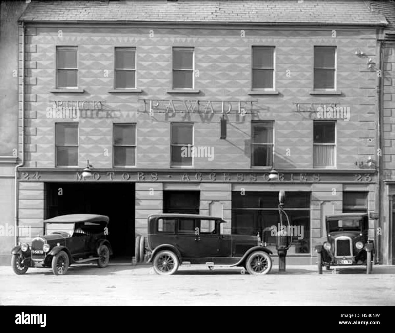 This image shows Mr. Wade's premises located on the quay, likely a ...