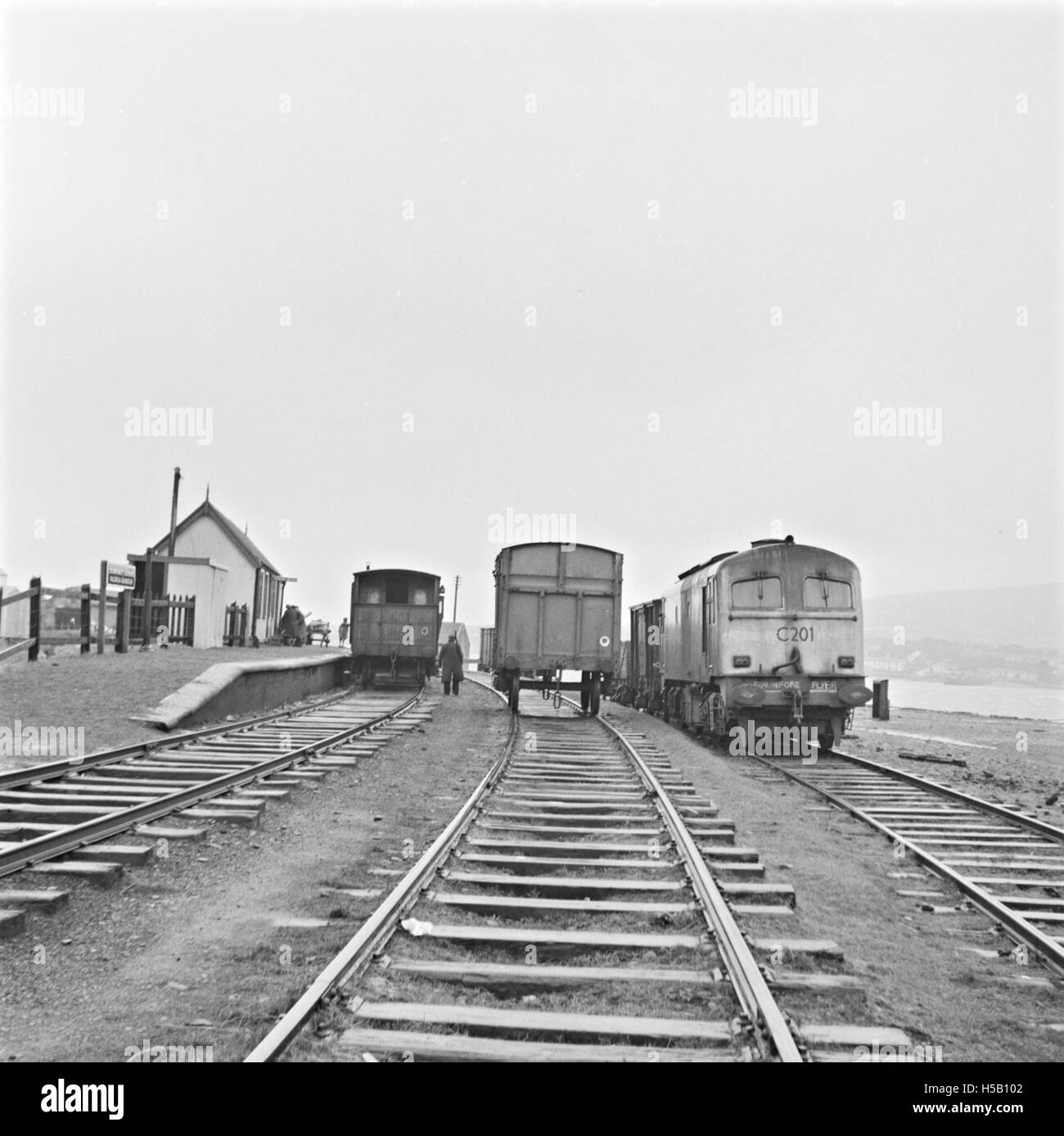 A photograph depicting a train at the station at Valentia Harbour ...