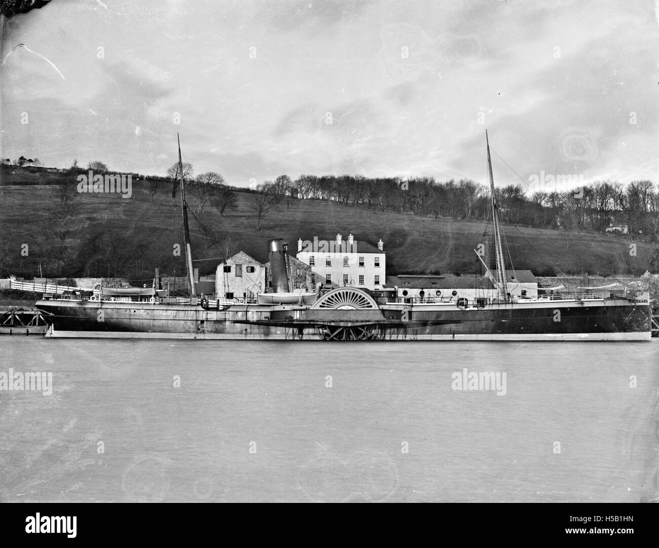 A description of a sharp-bowed paddle steamer, featuring raked masts ...