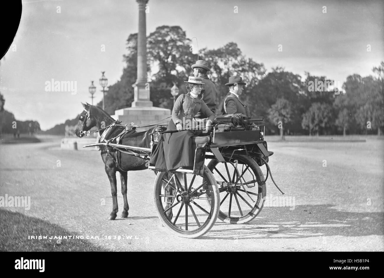 An Irish jaunting car, a traditional horse-drawn carriage, is shown in ...