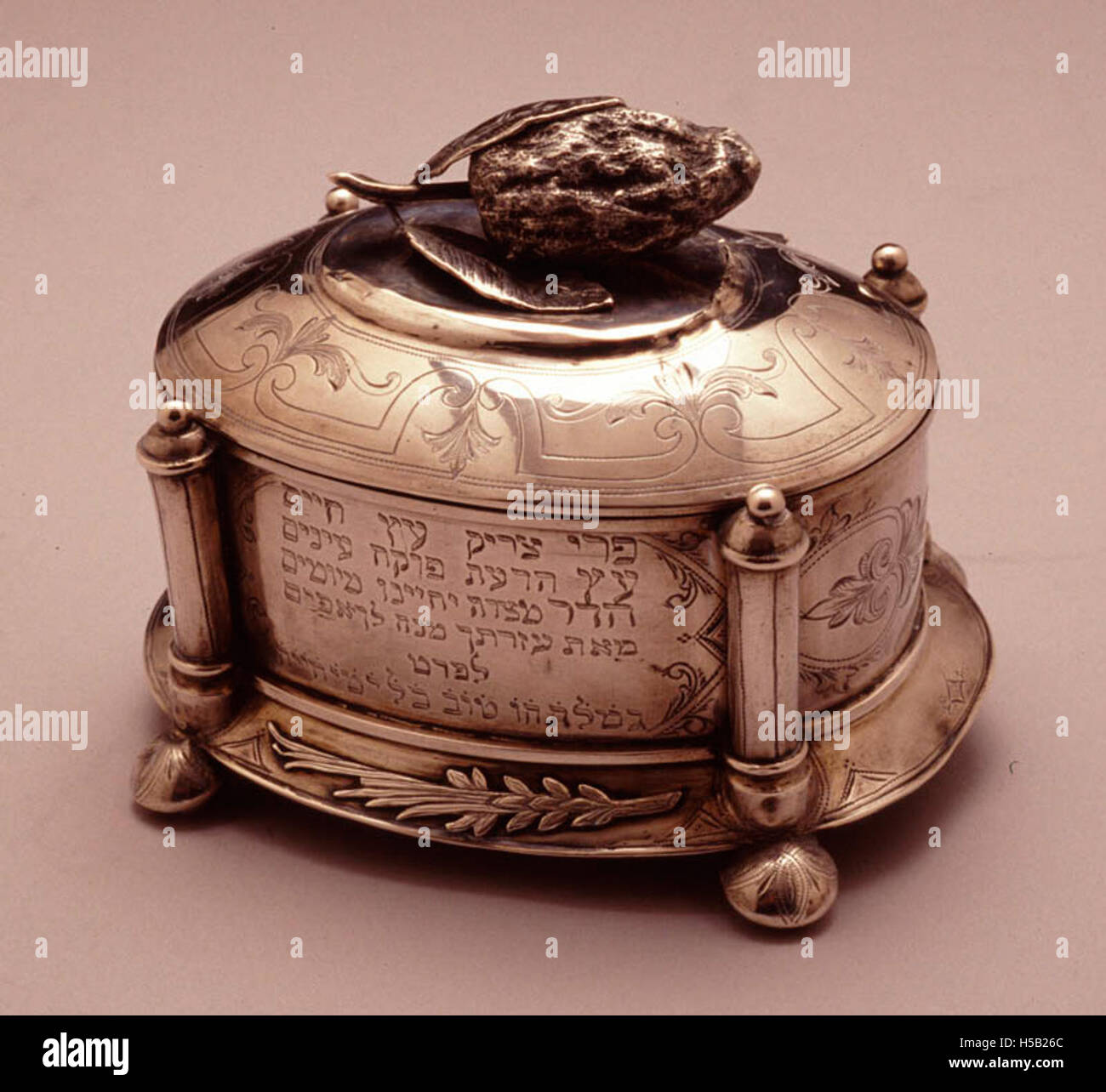 The Etrog container and oval casket are ceremonial objects used during ...