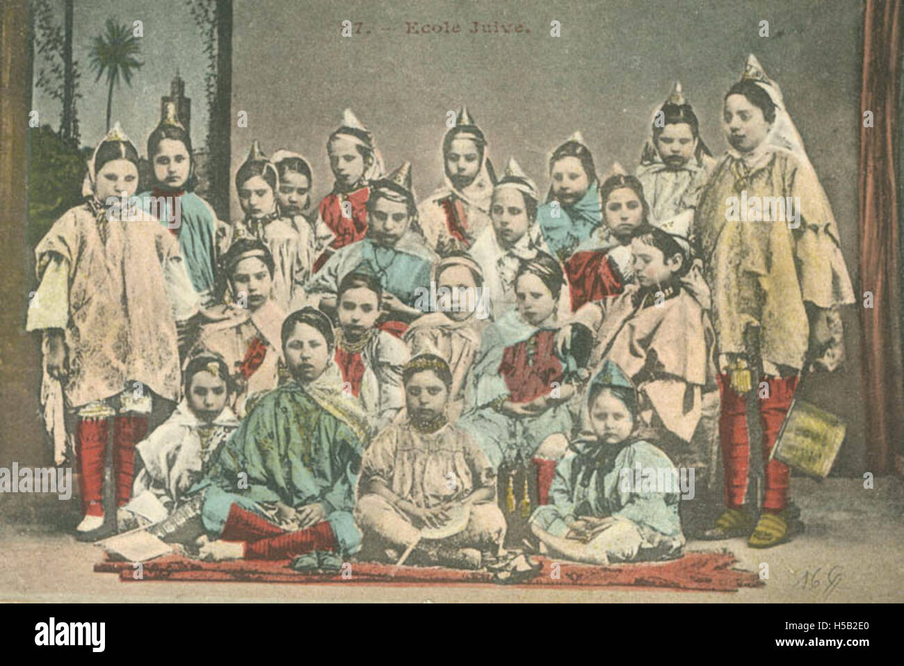 A vintage postcard showing Ecole Juive, a Jewish school, with a focus ...