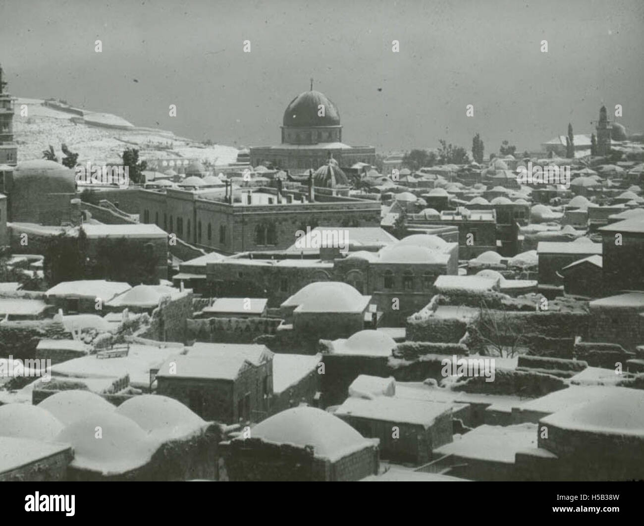 A winter view of Jerusalem, with snow covering the cityscape. The image ...