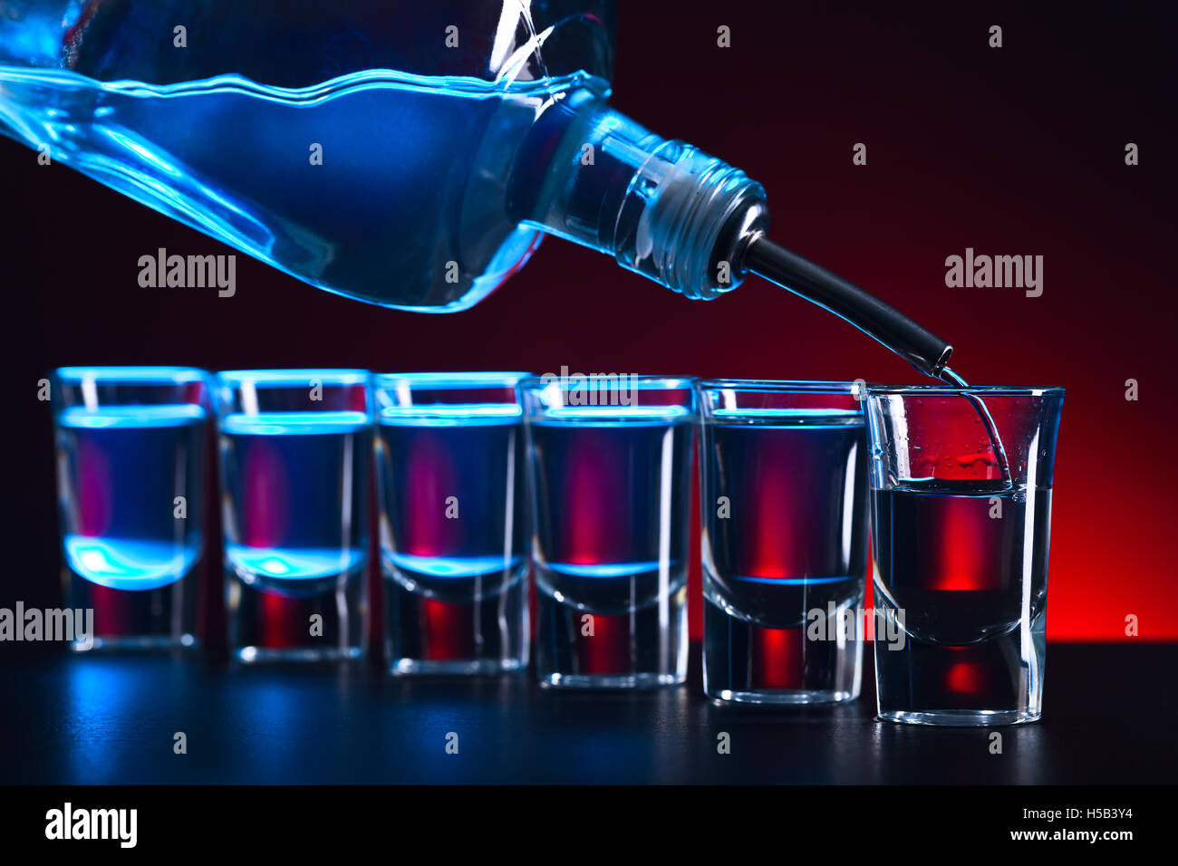 vodka in bar on a black table Stock Photo - Alamy