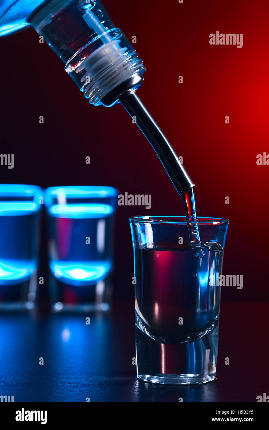 vodka in bar on a black table Stock Photo - Alamy