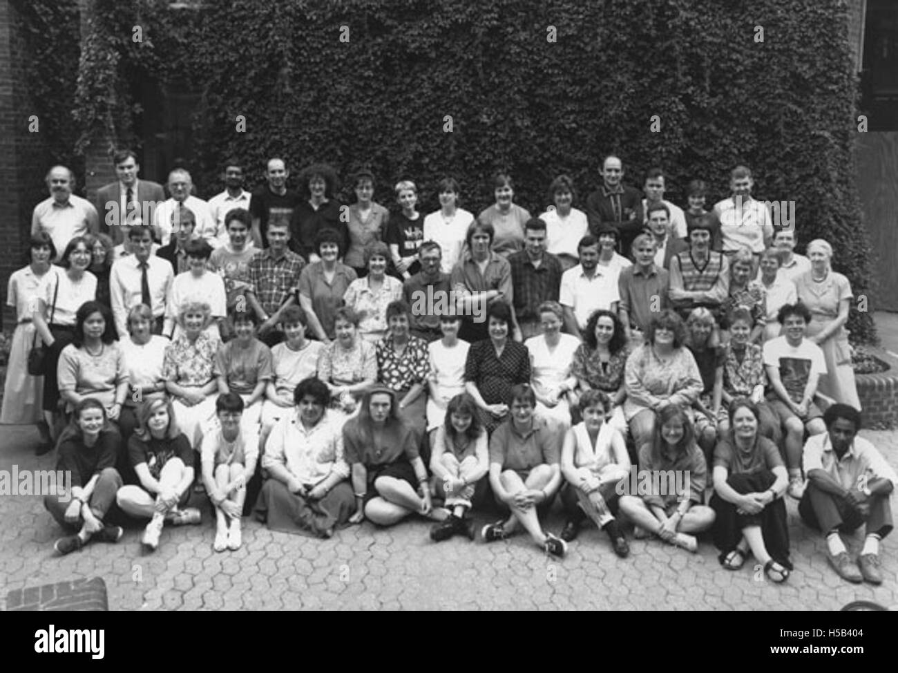 Library staff in the 1990s are shown in this photograph, reflecting the ...