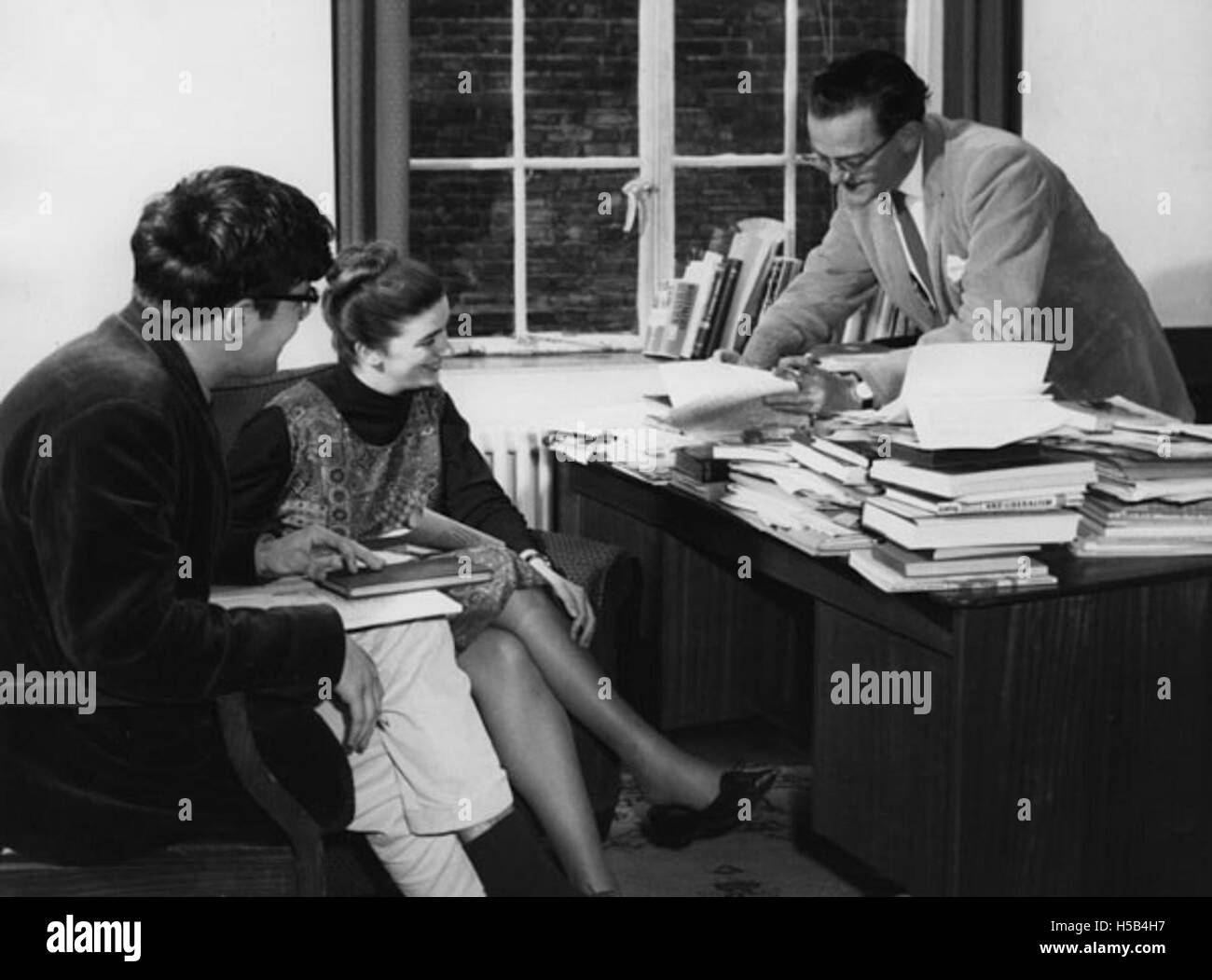 Donald MacRae pictured with students in April 1964, likely capturing a ...