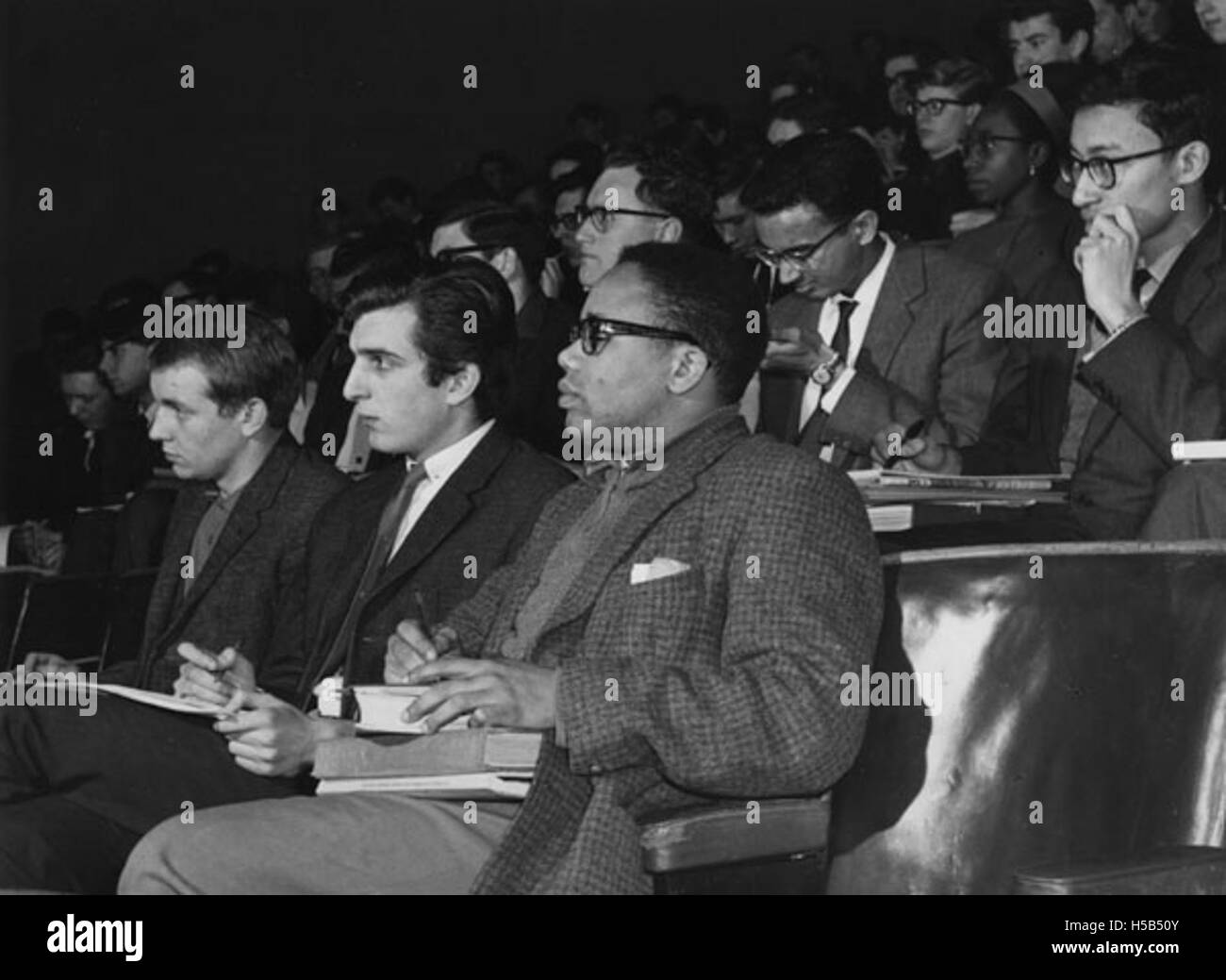 This image shows an audience in the New Theatre during 1964. The ...