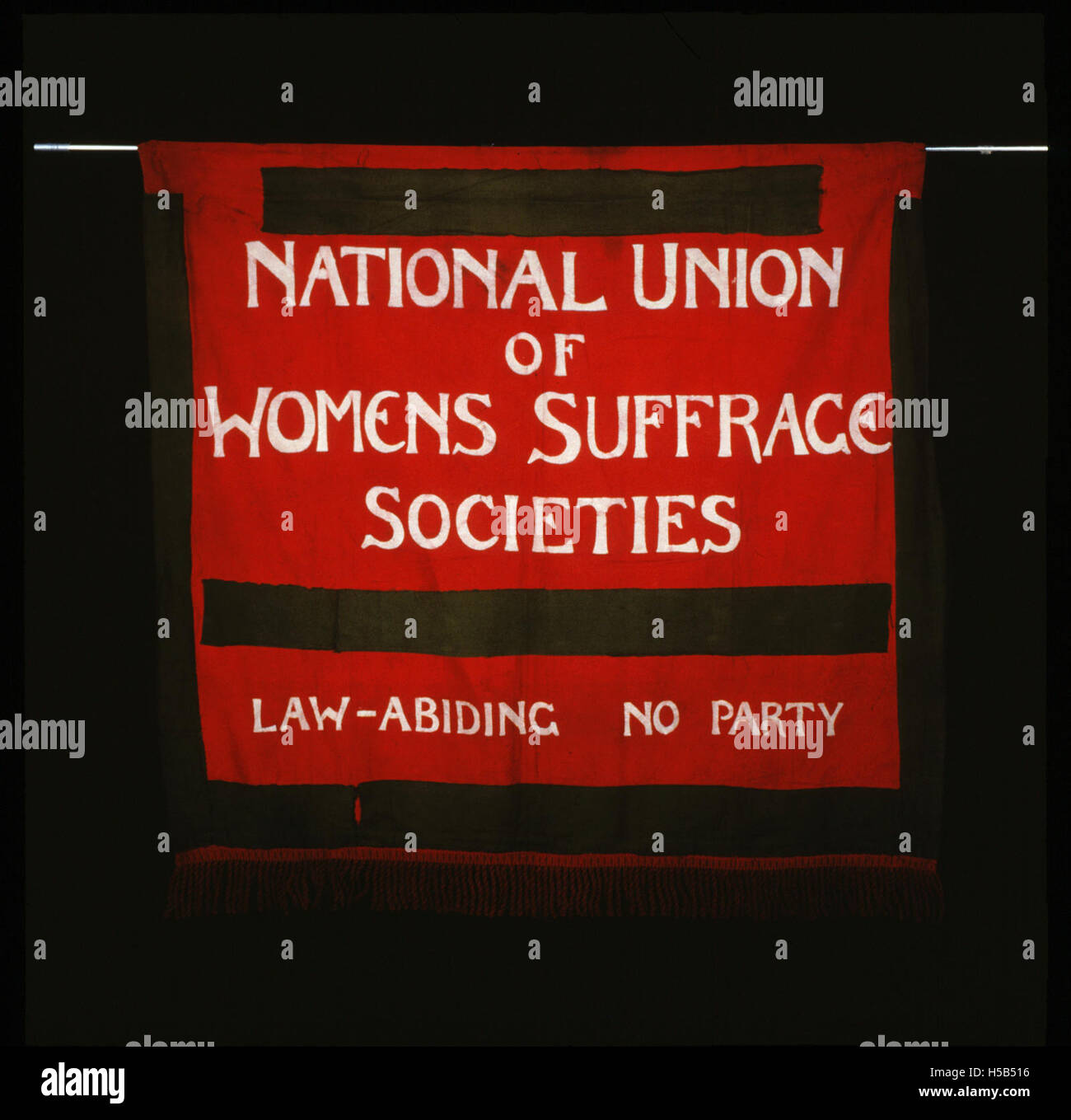 A banner promoting women's suffrage, likely from the early 20th century ...