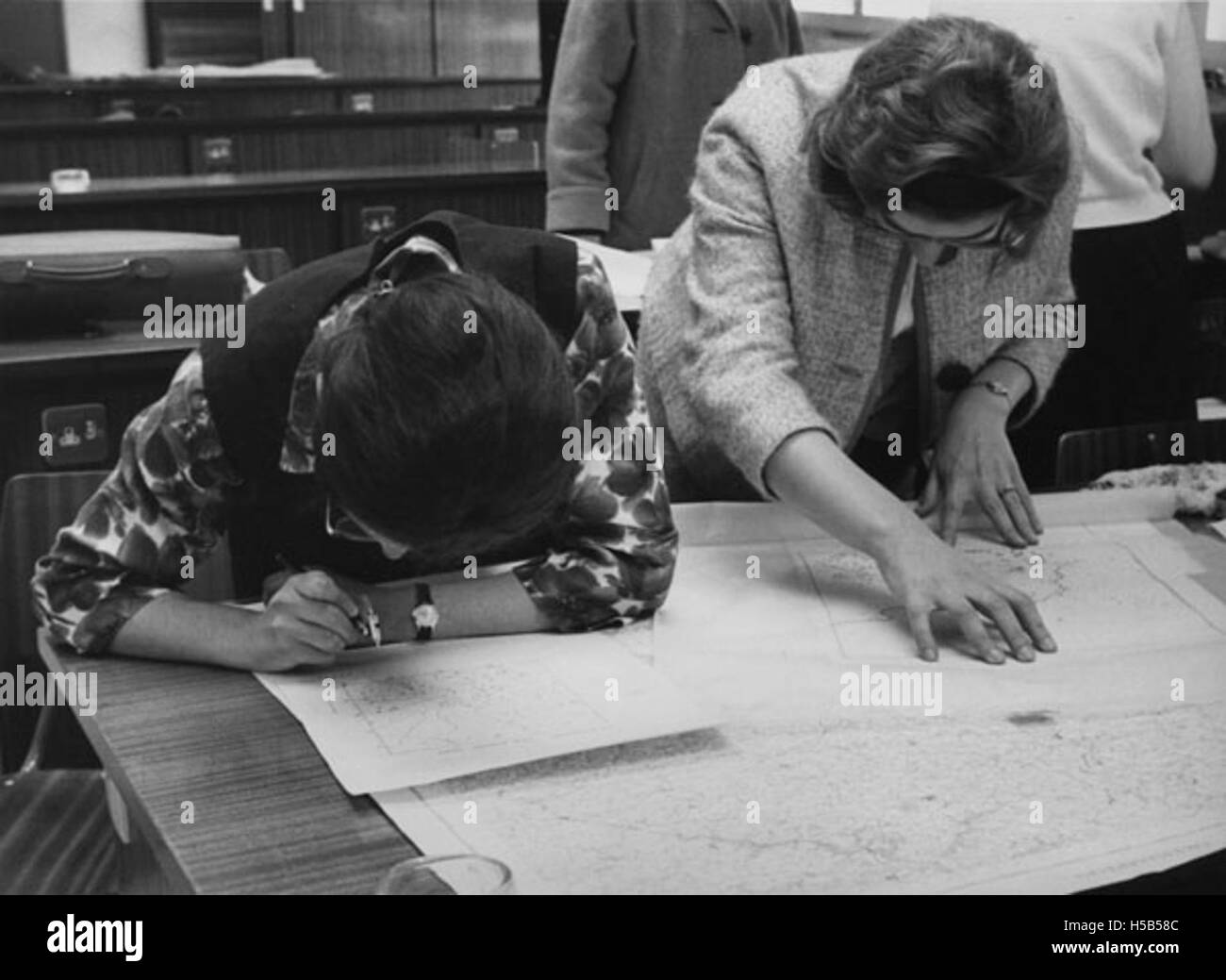 This photograph from 1964 depicts the Geography Department, capturing ...