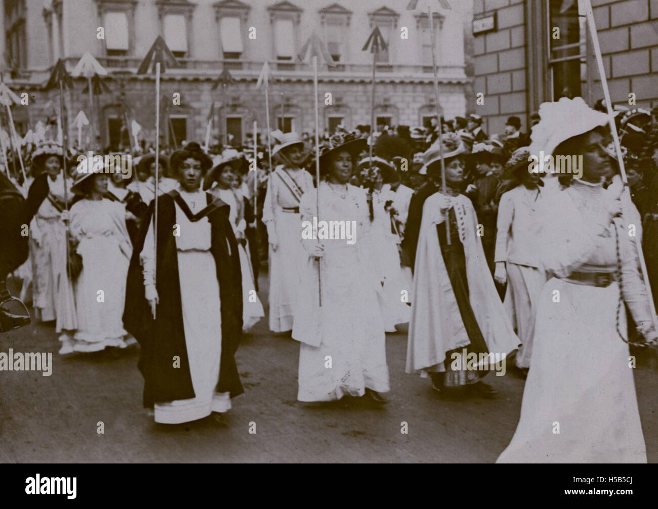 A procession of released prisoners is depicted in 1909, highlighting a ...