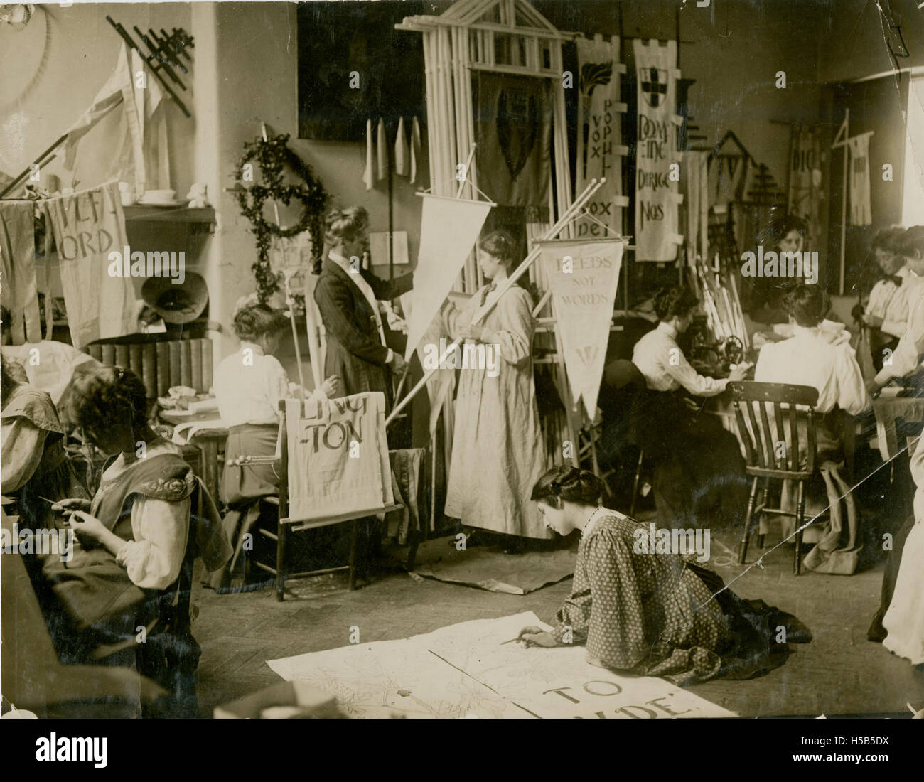 Women are shown creating banners for the Women's Social and Political ...