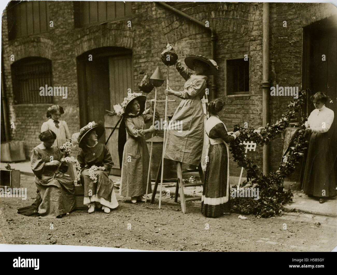 Making garlands for a Womens Social & Political Union (WSPU) rally ...
