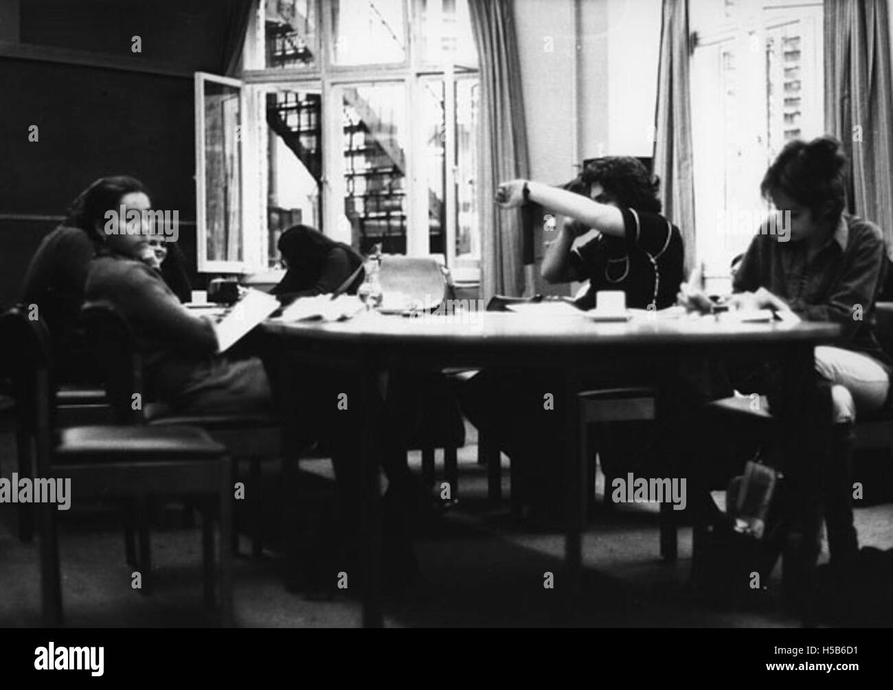 A photograph showing students in a study room, engaged in social ...