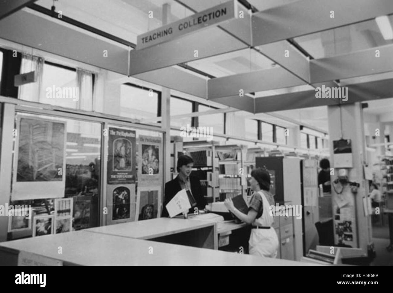 This image from around 1981 depicts a library, possibly a public or ...