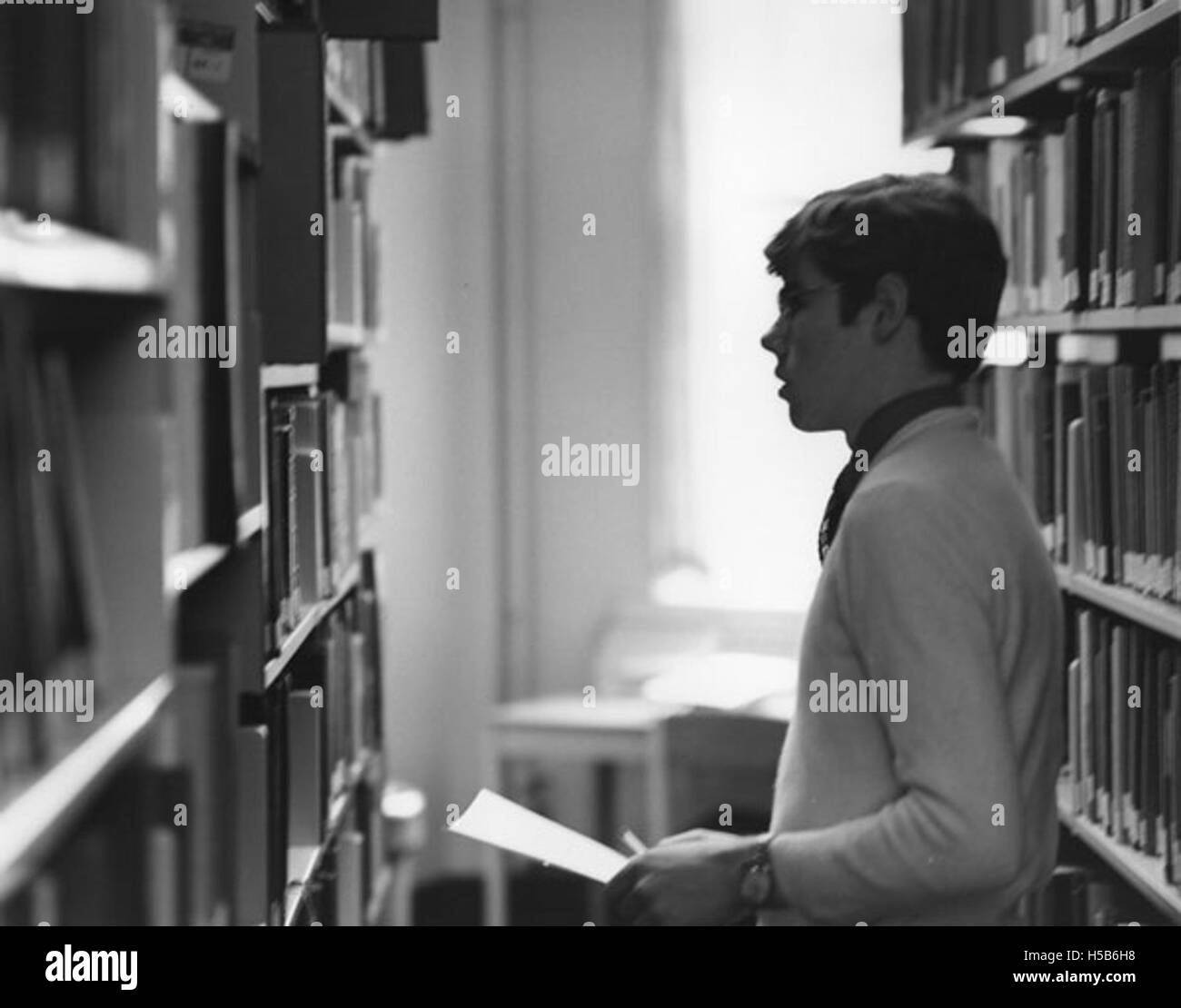 A photograph of a student studying in a library in 1981, reflecting the ...