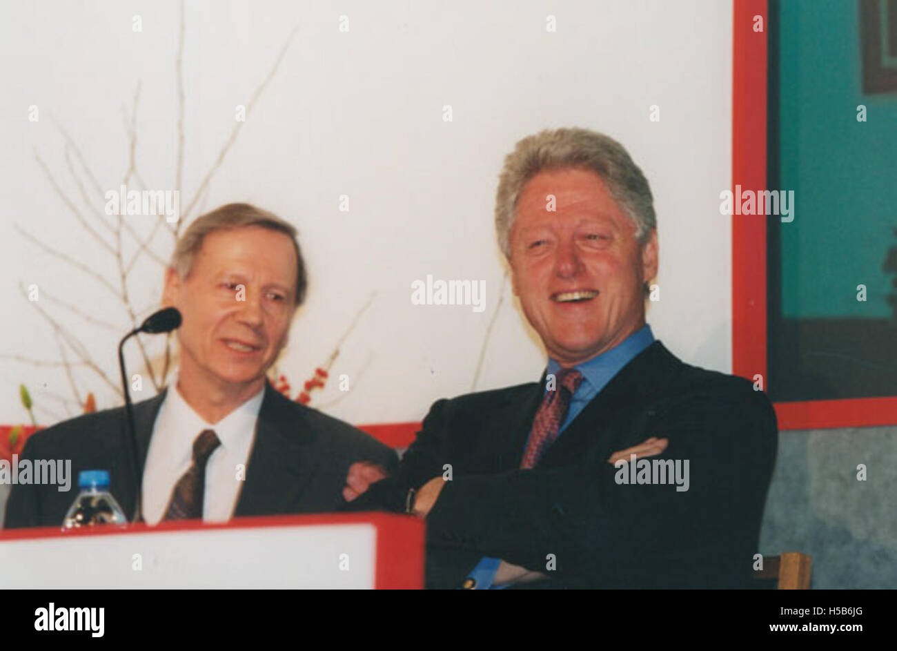 This photograph features former US President Bill Clinton with ...