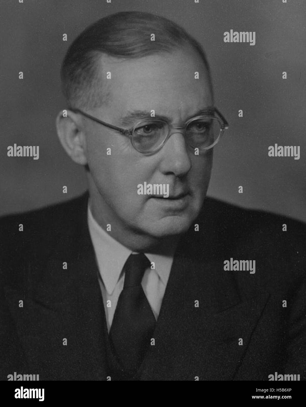 William Norton Medlicott is depicted in a portrait from the 1950s ...