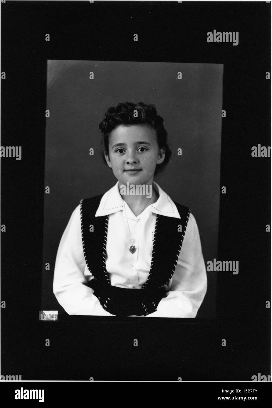 A portrait photograph of an unidentified young girl, captured in an ...