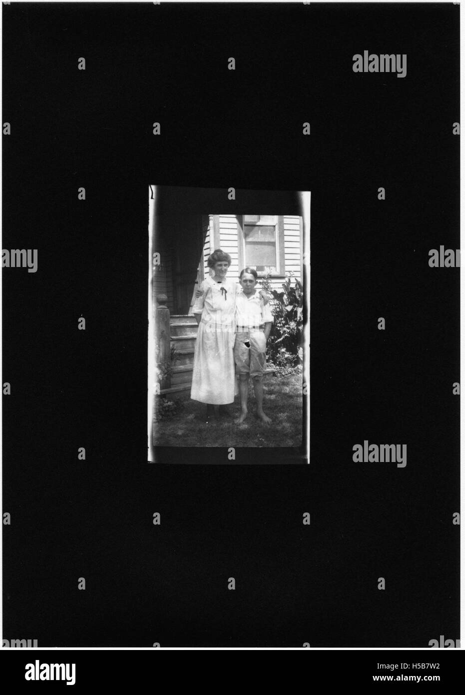 This photograph features Elizabeth Hamilton with an unidentified boy ...