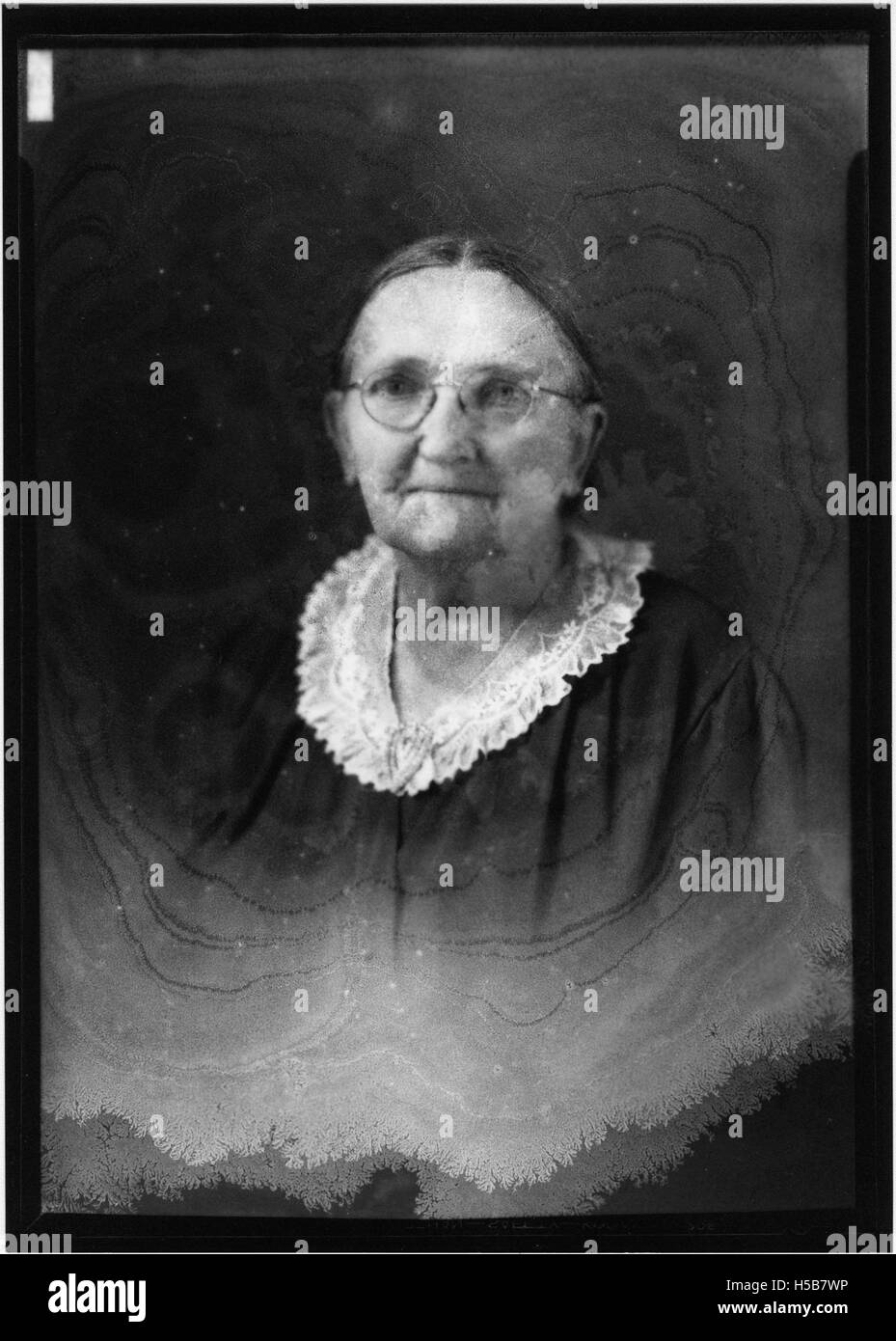 This portrait photograph features an unidentified woman, capturing a ...