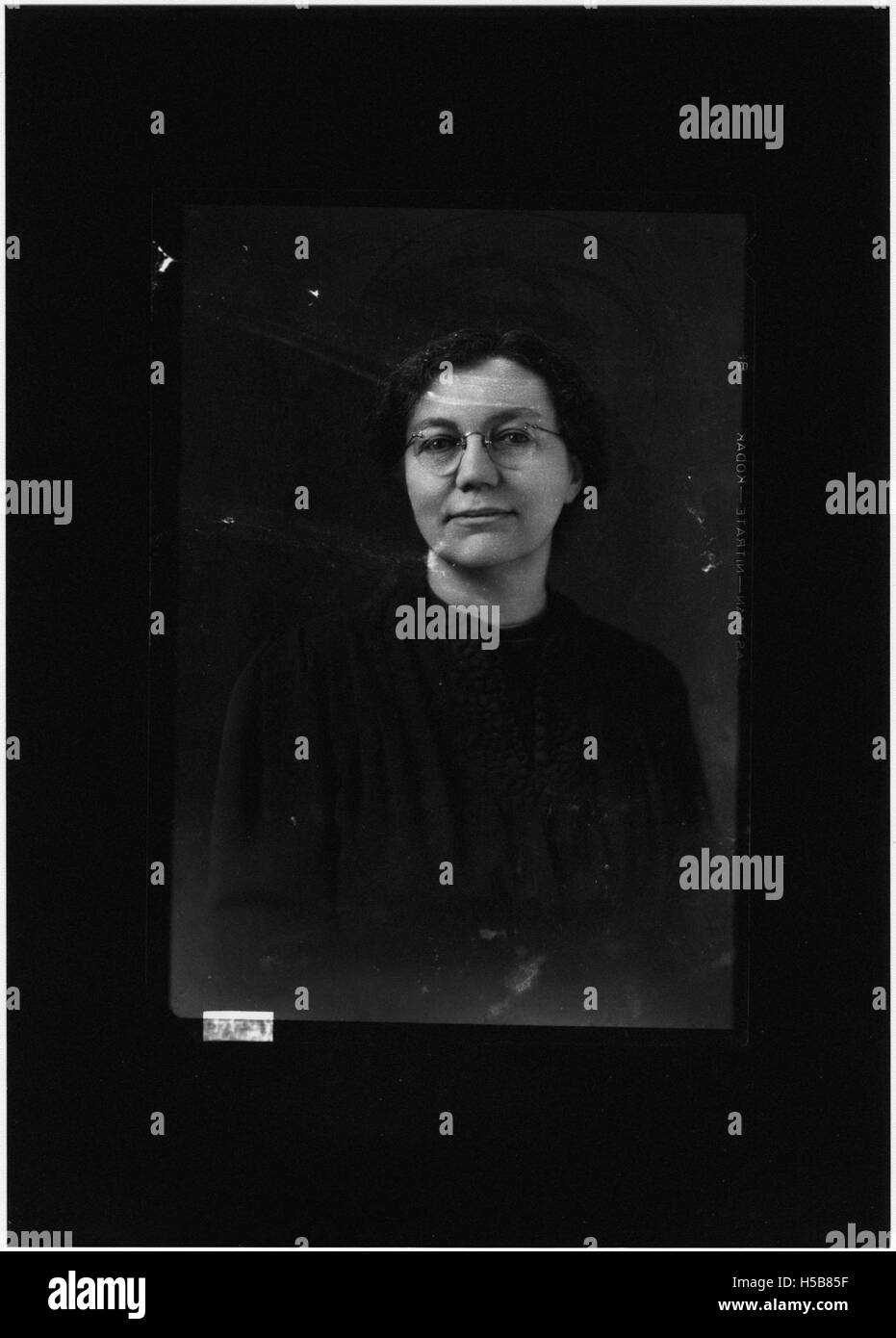 This portrait photograph shows an unidentified woman. The image’s ...