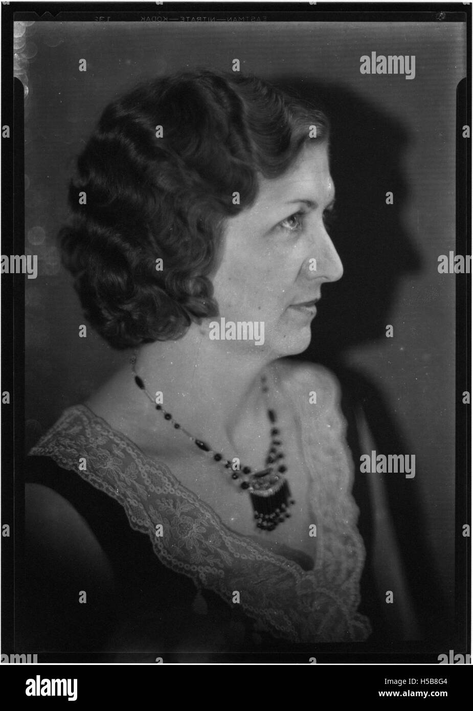 This portrait photograph features an unidentified woman, capturing her ...
