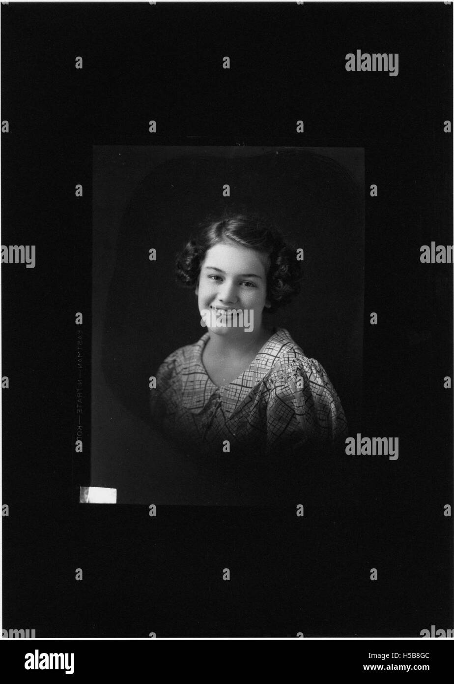 A portrait photograph of an unidentified woman. The image captures a ...