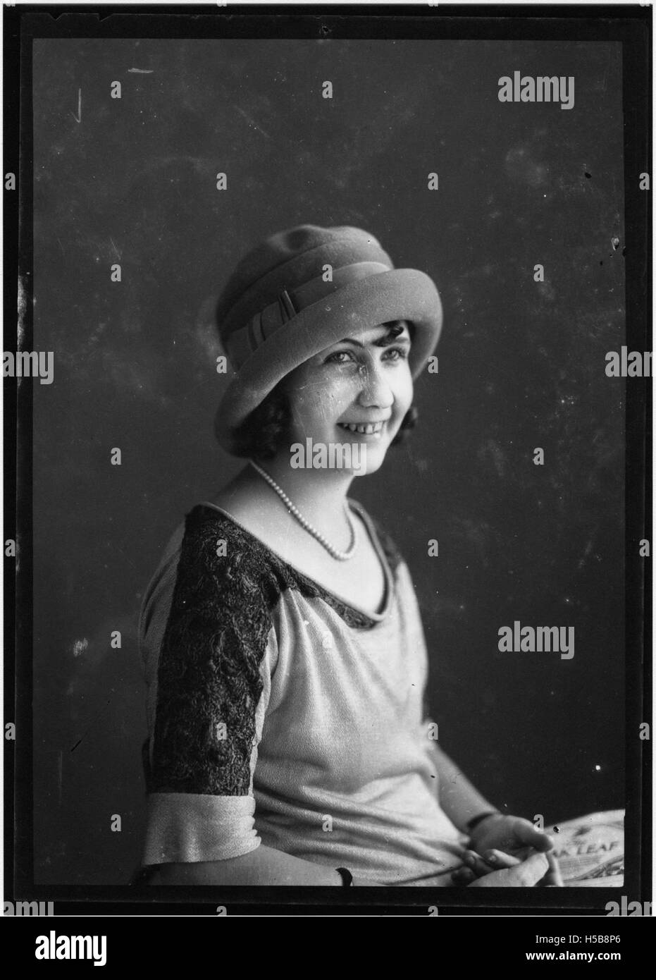 This portrait photograph captures an unidentified woman. Her identity ...
