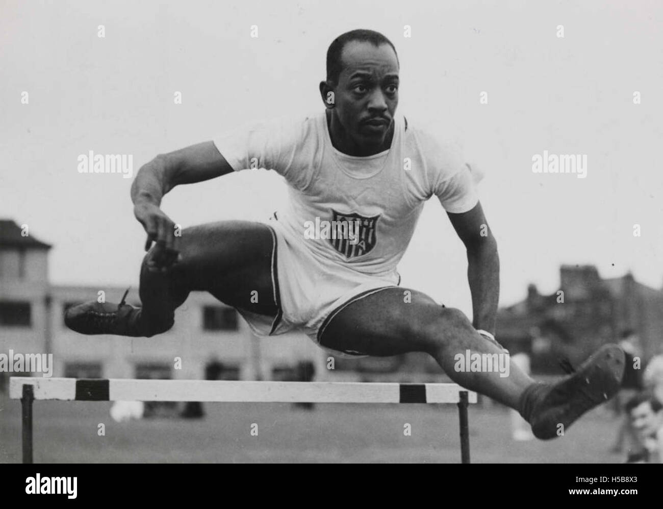 Harrison Dillard, an American athlete, competes in the 110m hurdles at ...