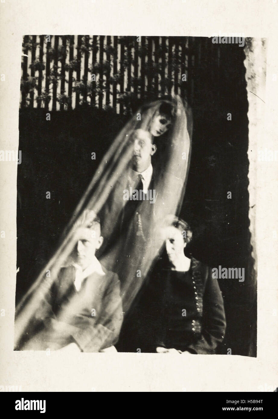 Woman with two boys and a female spirit Stock Photo - Alamy