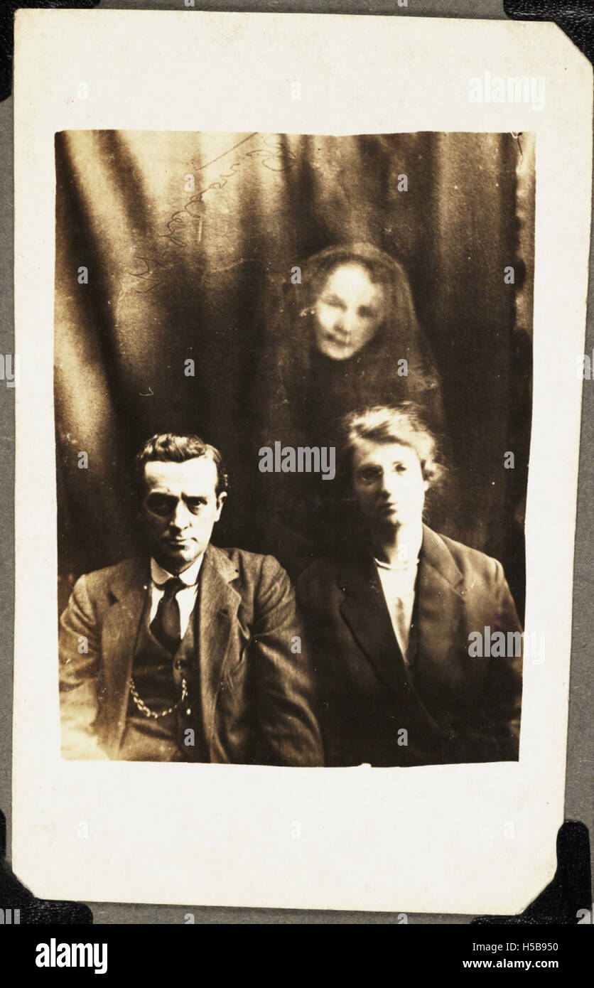 A photograph showing a couple with a female spirit, captured in a ...