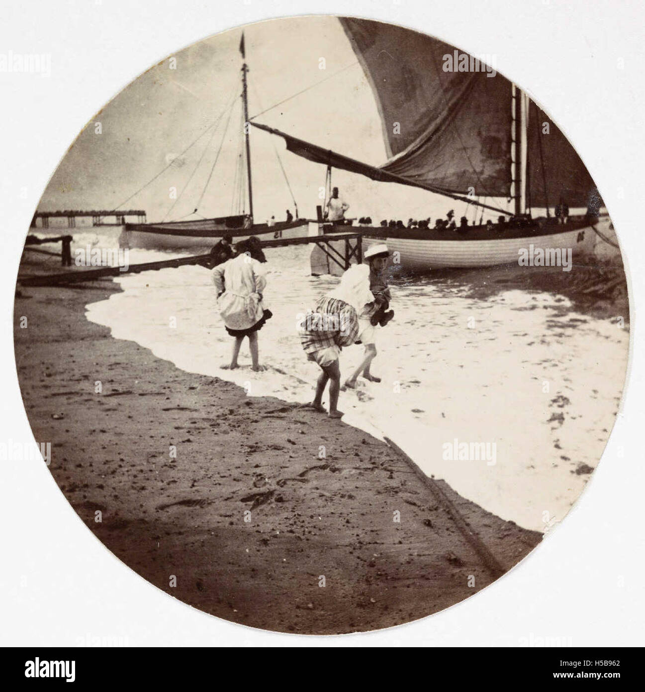 Children paddling in the sea Stock Photo - Alamy