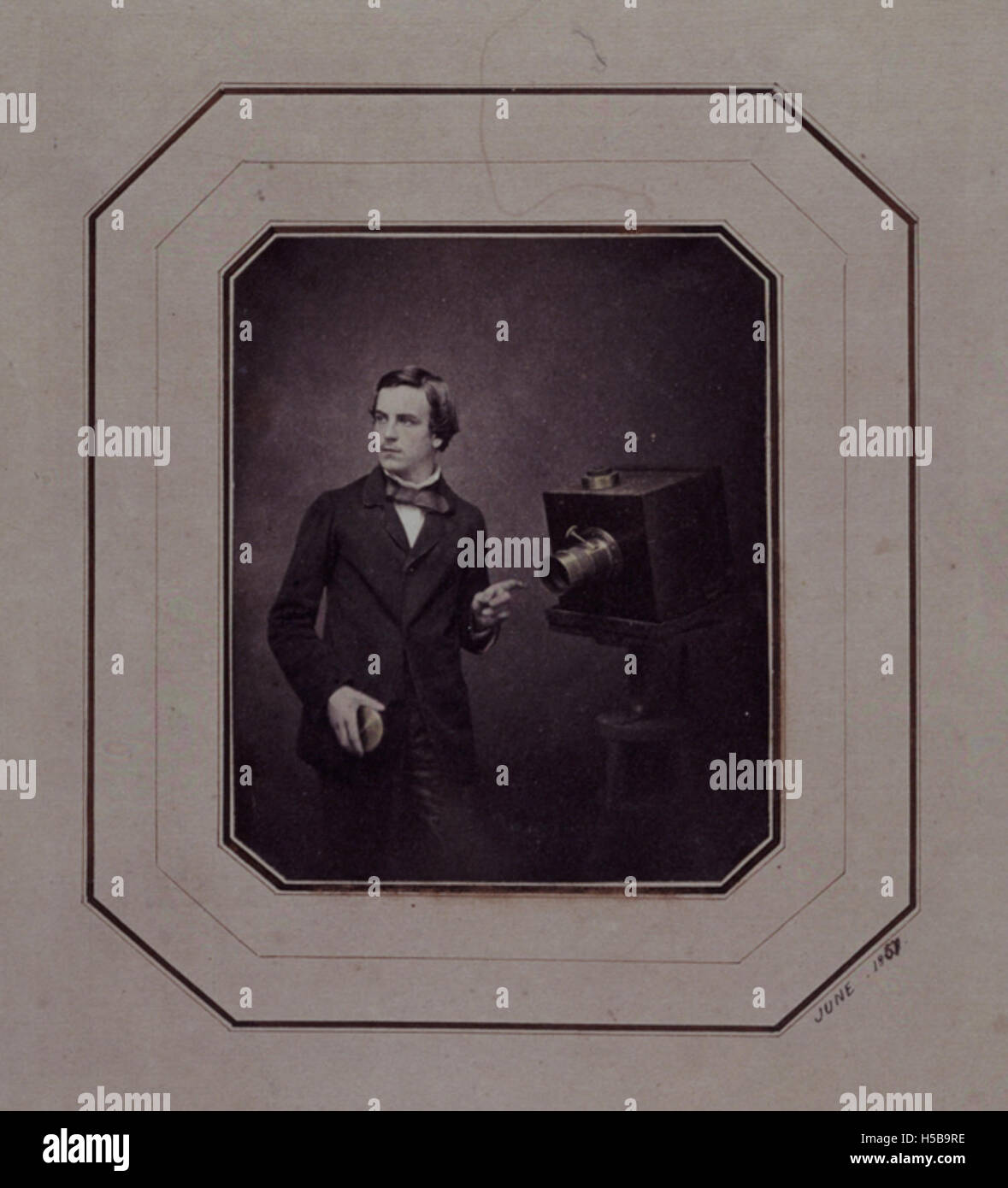 This self-portrait features the photographer with their camera ...