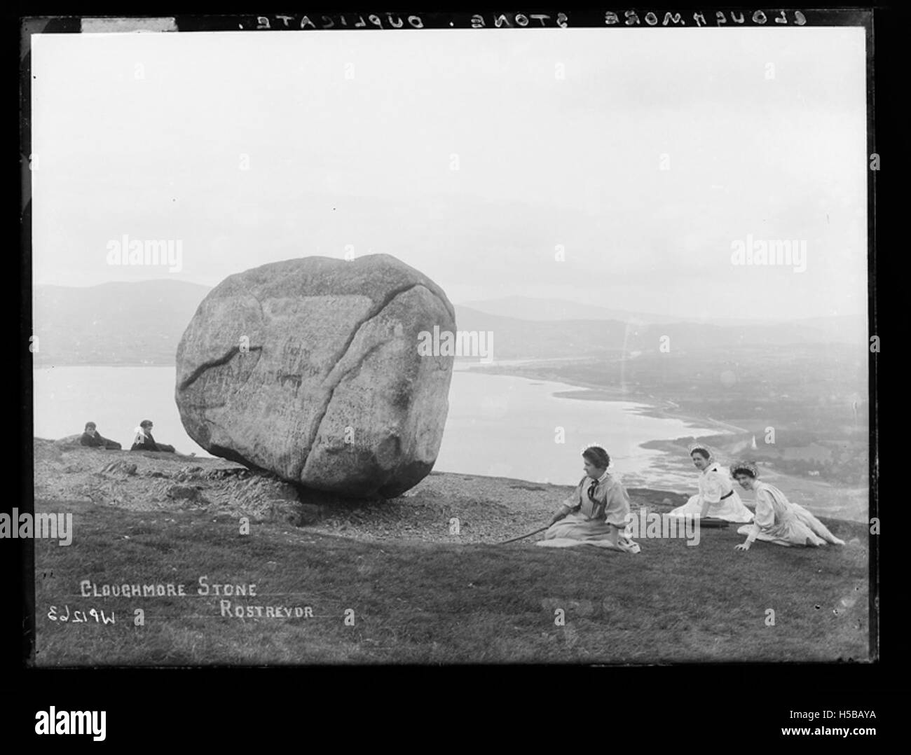 Cloughmore Stone, located in Rostrevor, Northern Ireland, is depicted ...