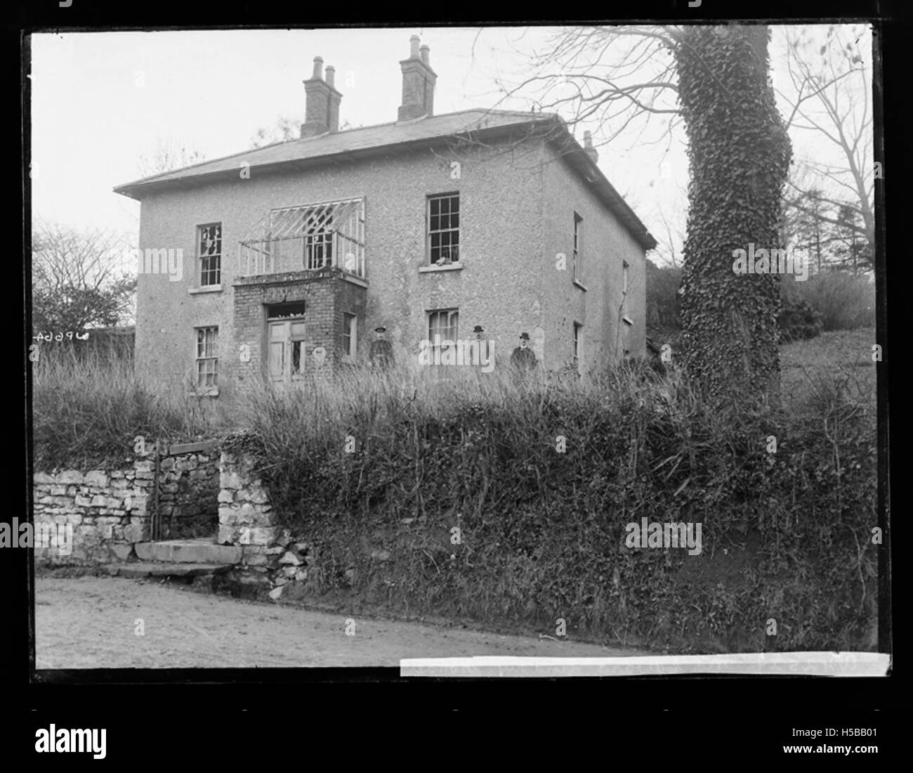 This image depicts a derelict dwelling, a building that has fallen into ...